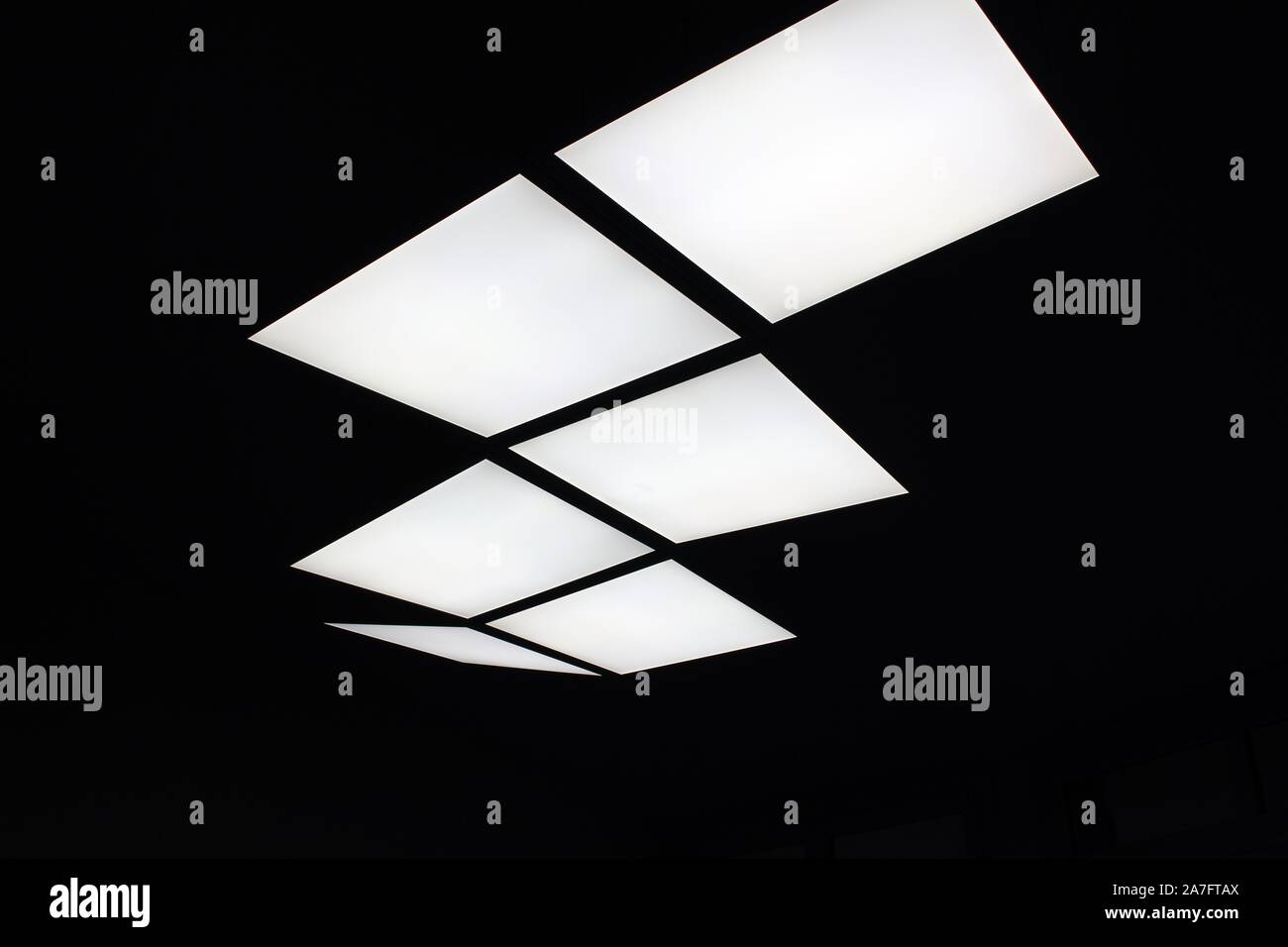 Series of white ceiling light with led light, with black background ...