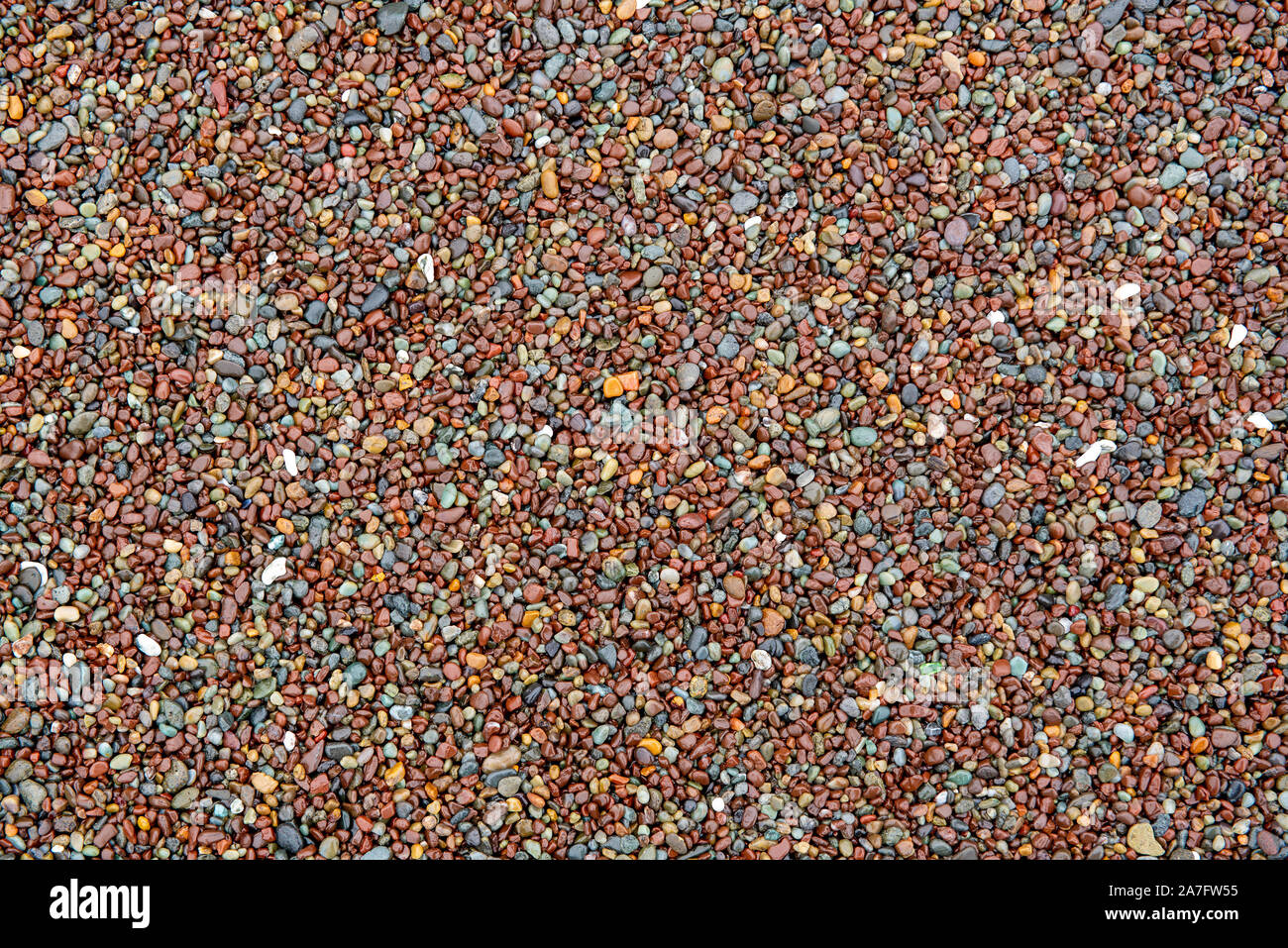 Colorful pebbles in lieu of sand at a beach in Northern California ...