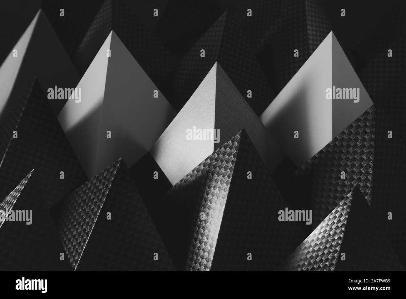 Triangular shapes of paper on dark background, abstract Stock Photo - Alamy