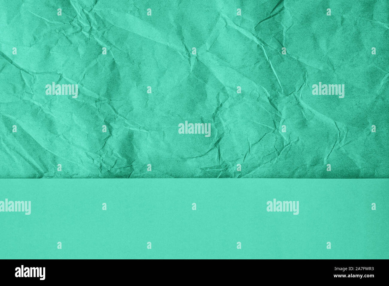 Crumpled and plain paper sheets divided in center creating line ...