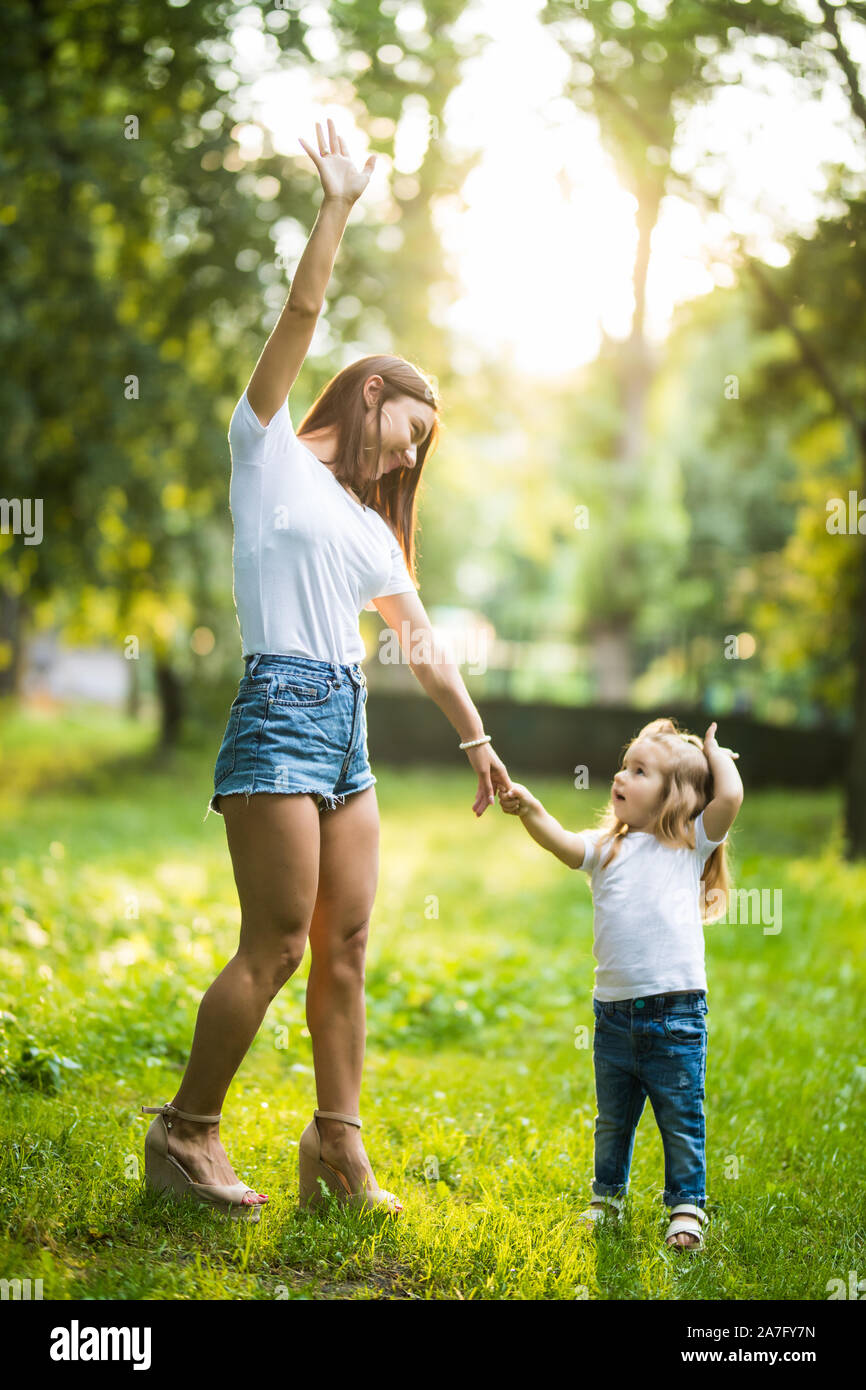 mother and daughter hugging in love playing in the park Stock Photo - Alamy