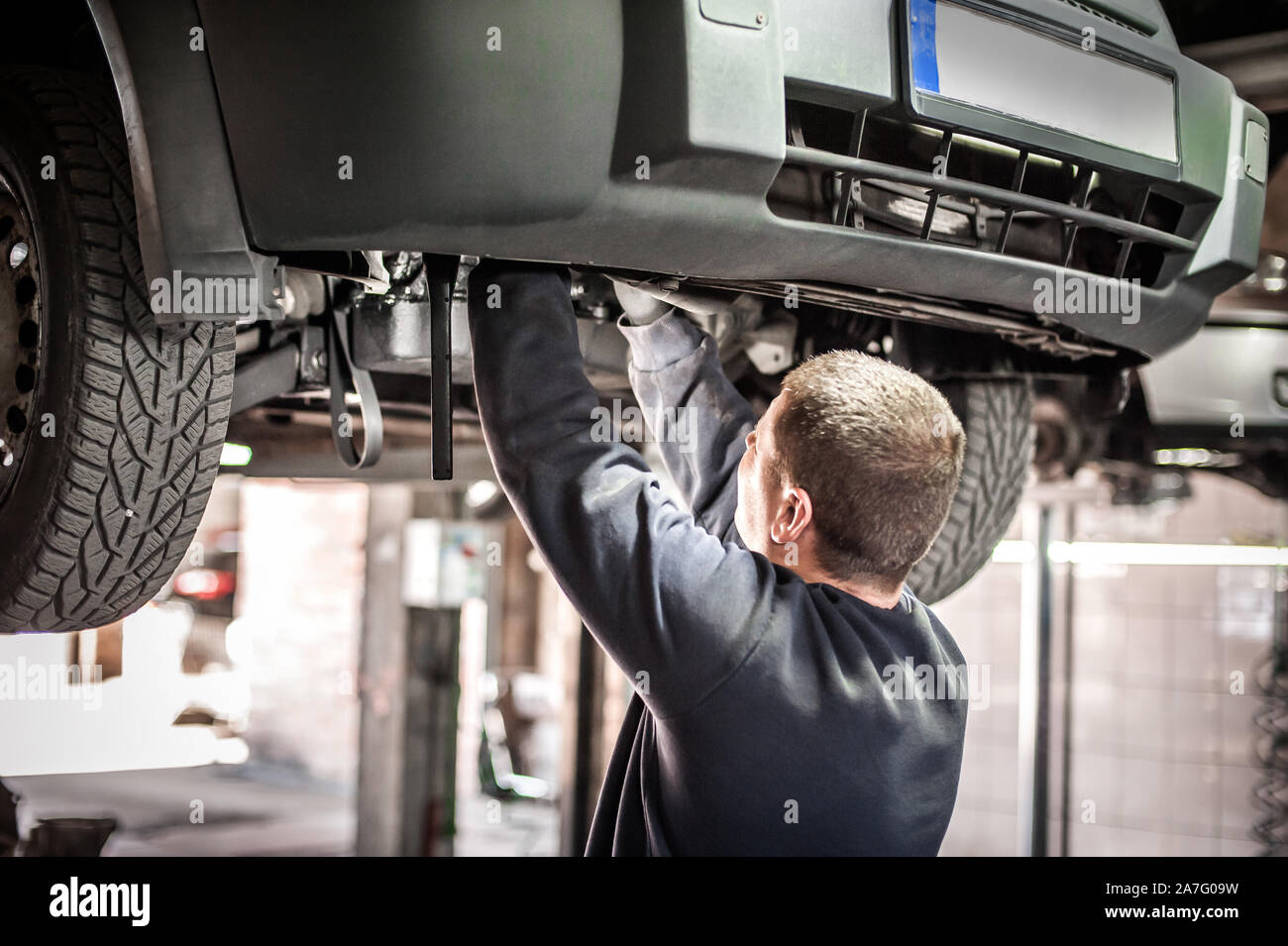 Car mechanic checking condition hi-res stock photography and images - Alamy
