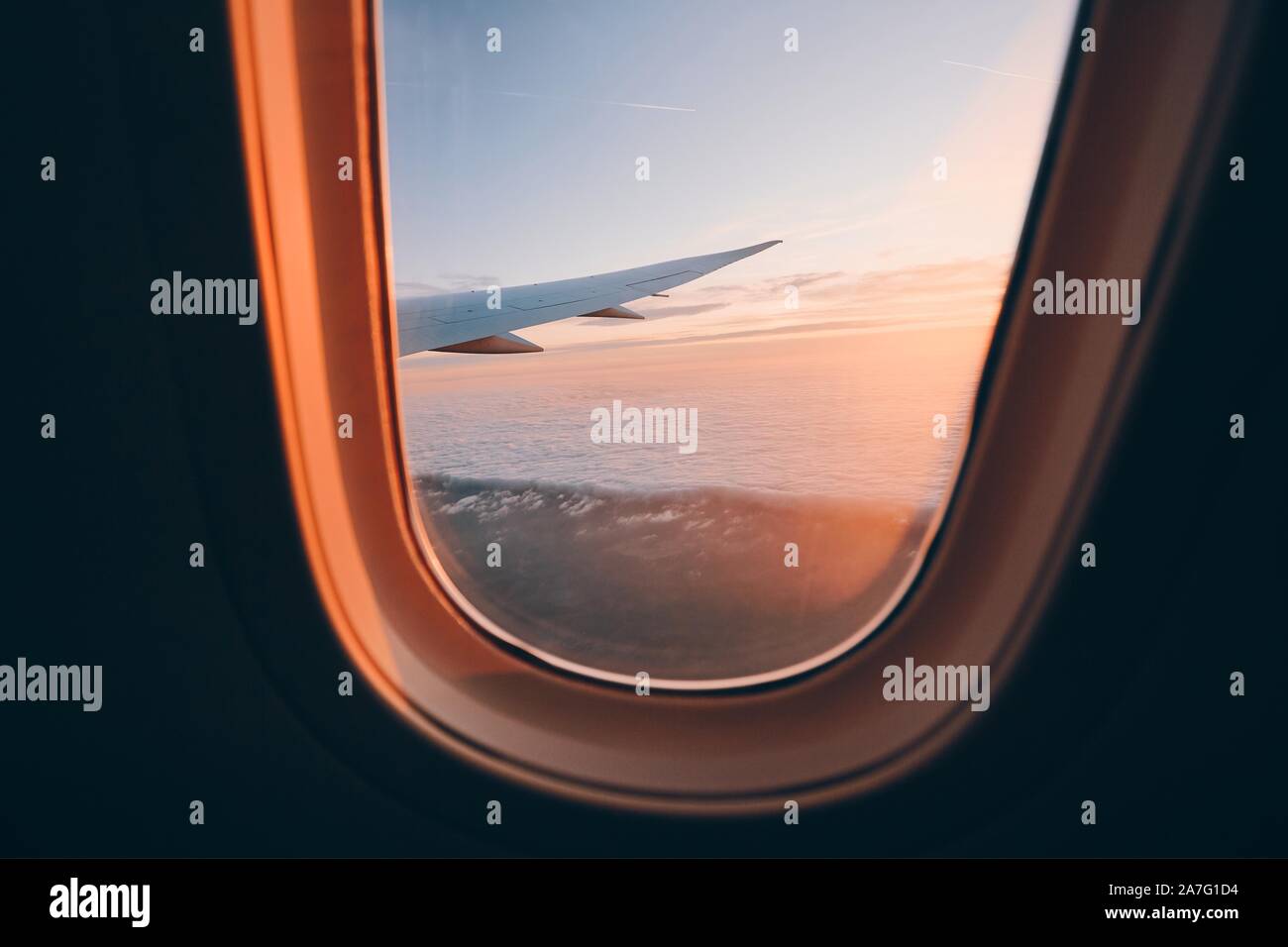 View from window of airplane during flight above clouds at beautiful ...
