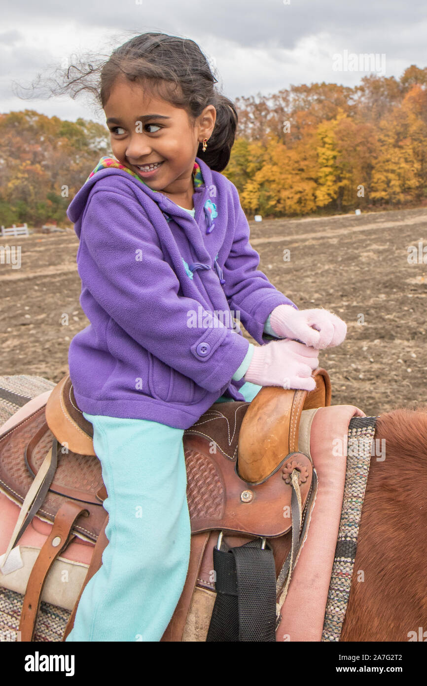 Children riding a horse hi-res stock photography and images - Alamy