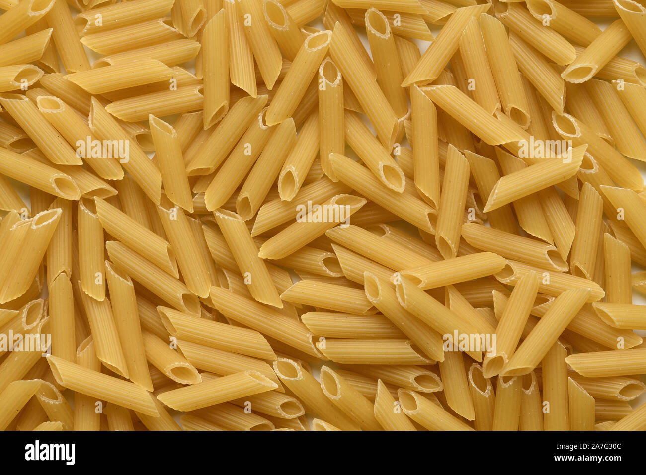 Pasta Penne Rigate background, top view. Puristic Italian cuisine theme ...