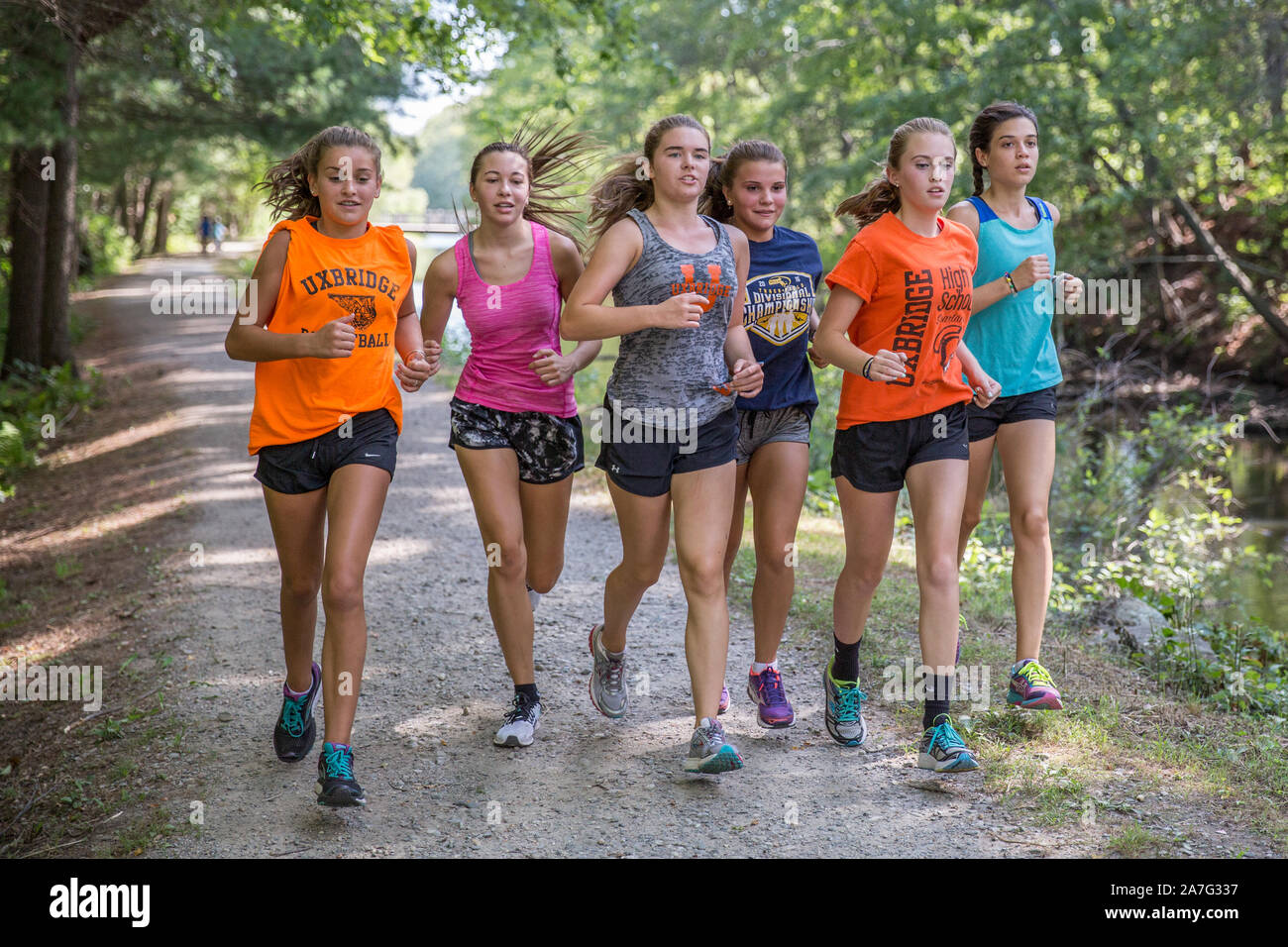 Young teenage girls jogging in the Blackstone Valley Park Stock Photo ...