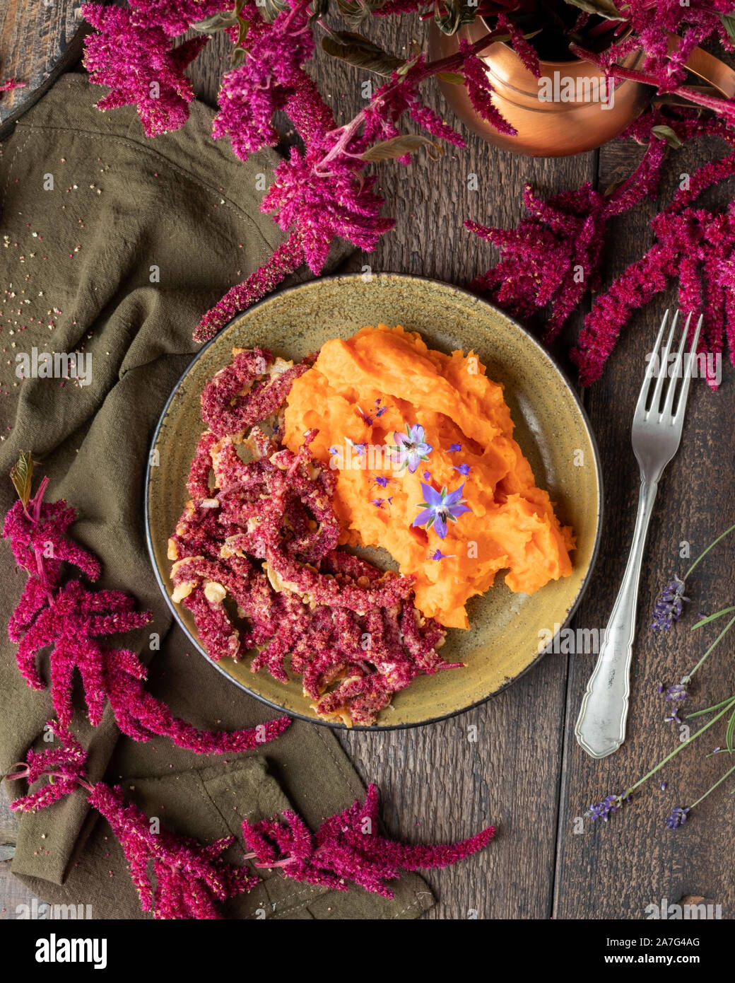 Fried Amaranthus caudatus flowers with sweet potato puree, decorated ...