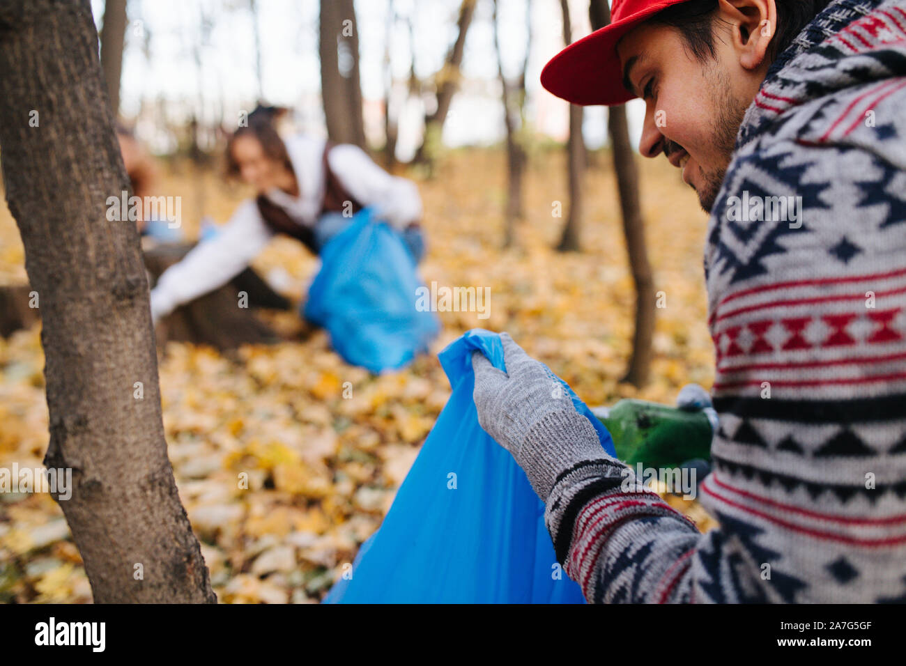 Person picking up litter in a park hi-res stock photography and images ...