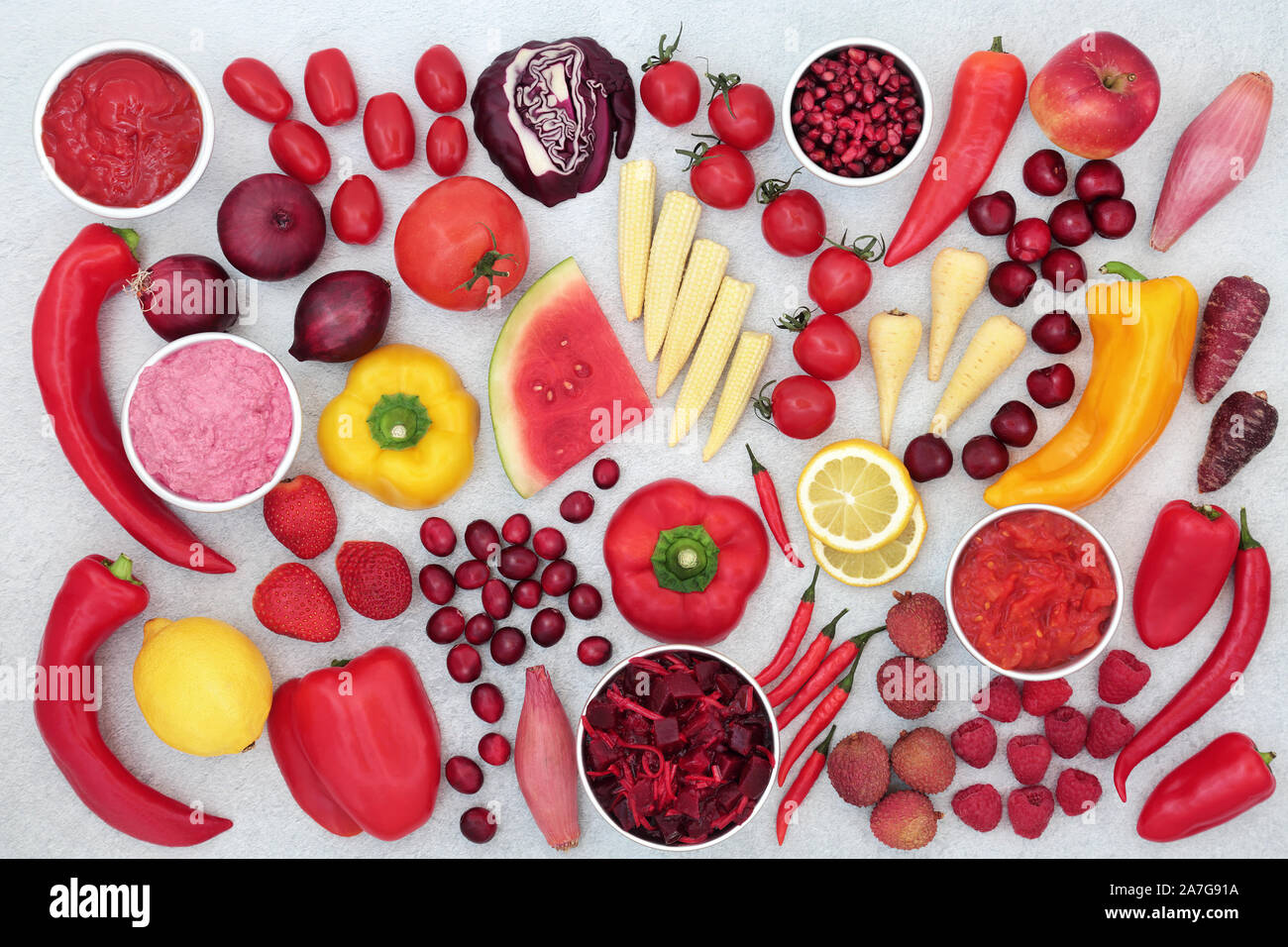 Vegan food for good health with red, purple and yellow fruit ...