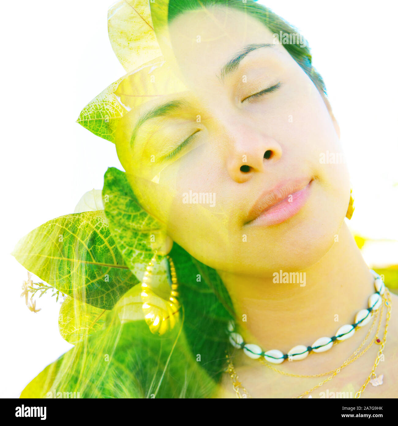 Double exposure portrait of a young, relaxed natural beauty with head ...