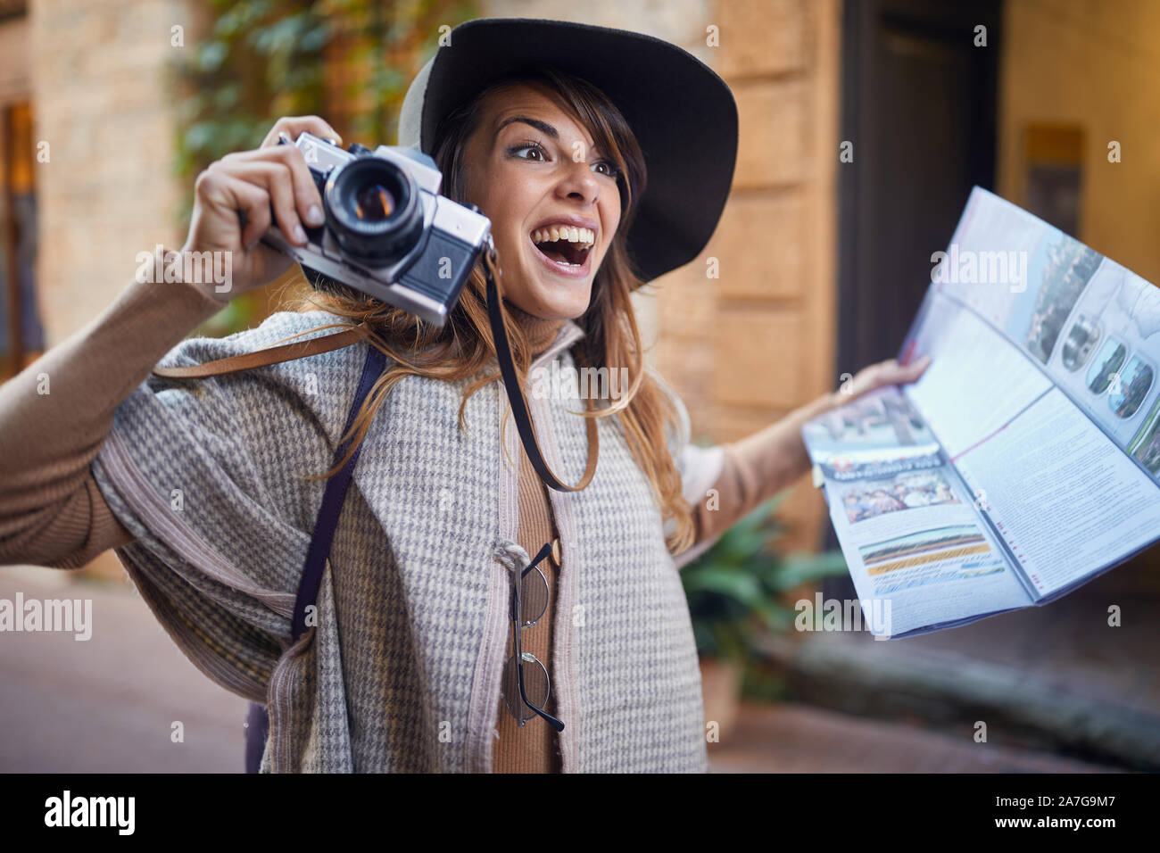 Tourist Smiling Woman With Camera Taking Photos Of Beautiful Location ...