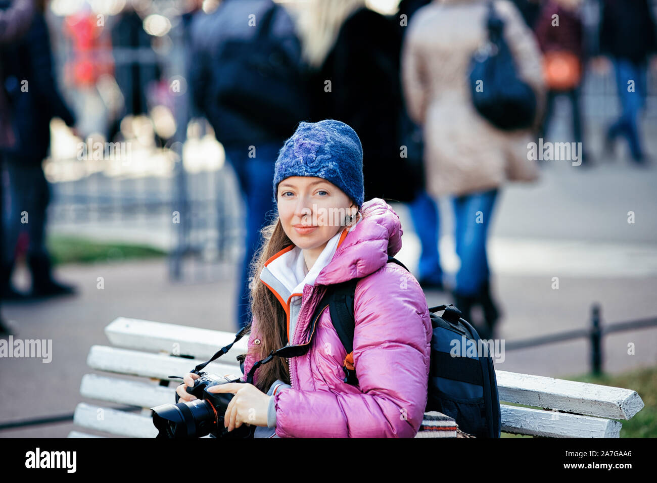 Young lady with camera sitting on the bench in St Petersburg Stock ...