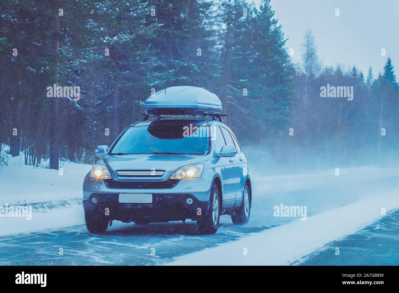 Car with roof luggage rack on road in Finland Stock Photo - Alamy