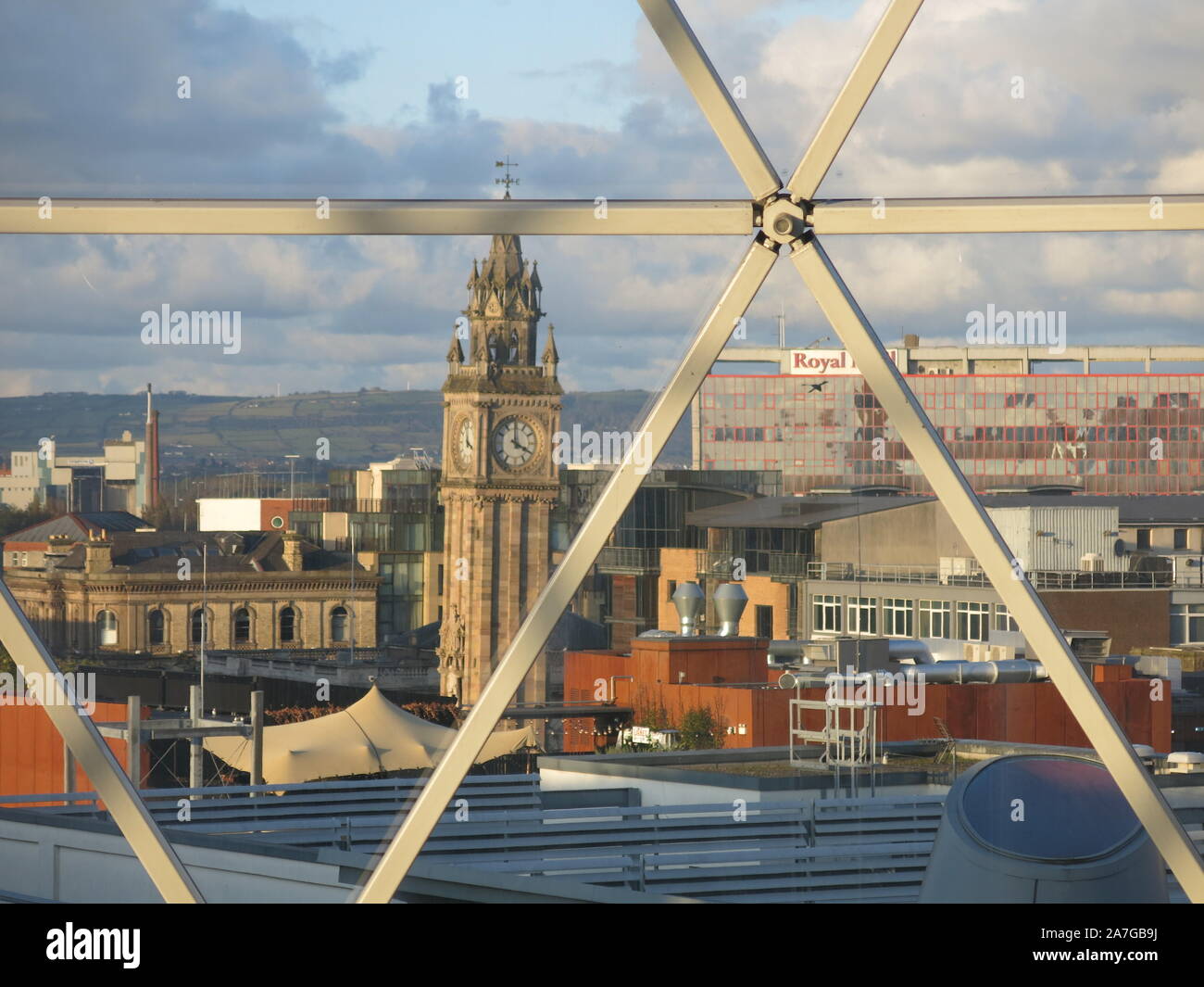 Impressive views of a tall clock tower on the Belfast skyline through ...