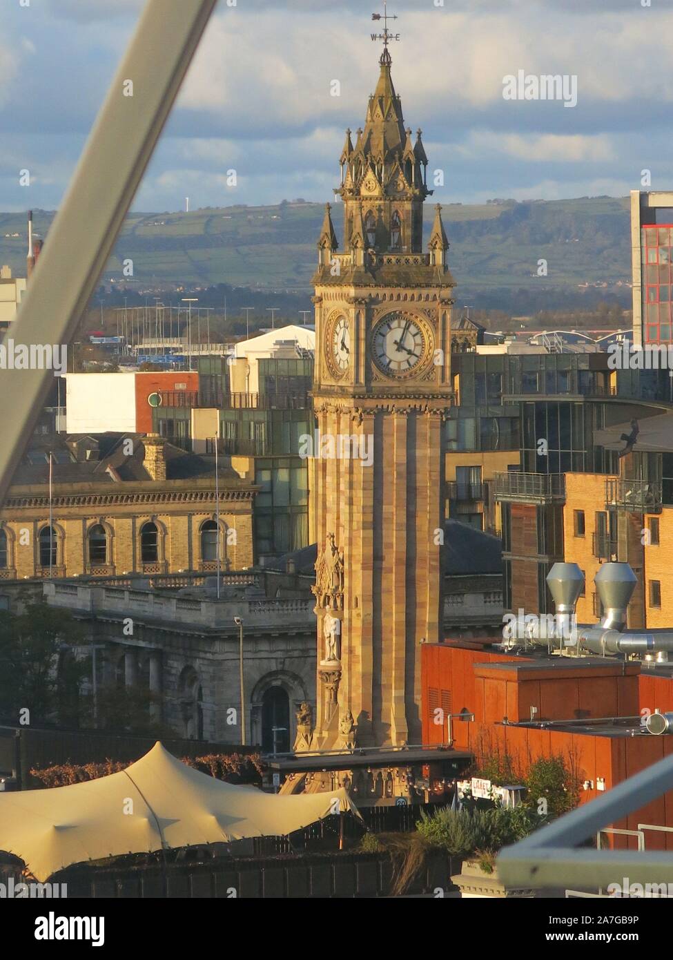 Impressive views of a tall clock tower on the Belfast skyline through ...