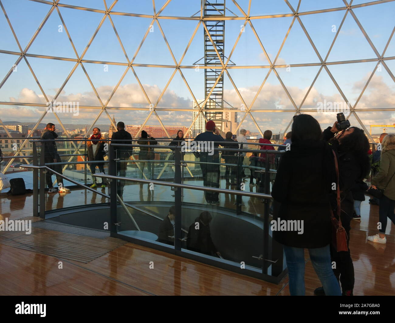 Figures silhouetted by the evening sun on the viewing platform at the ...