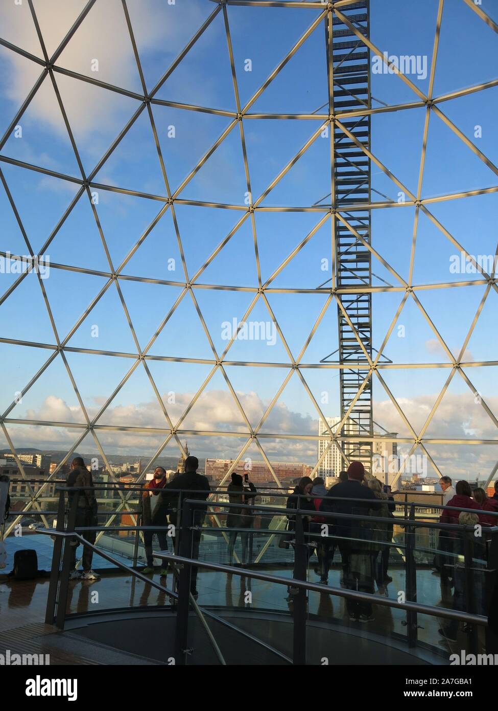Figures silhouetted by the evening sun on the viewing platform at the ...