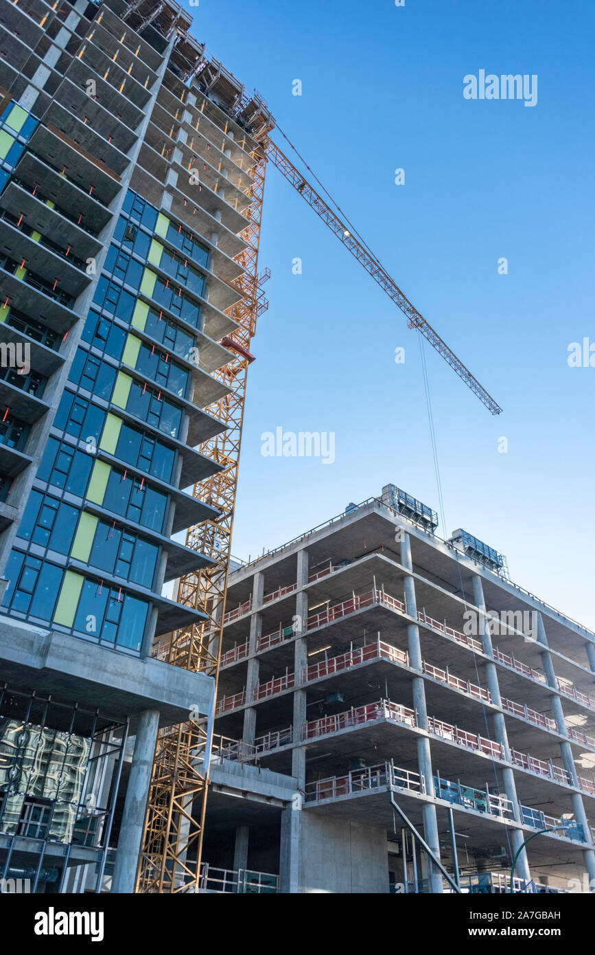 High-rise buildings under construction on blue sky background Stock ...