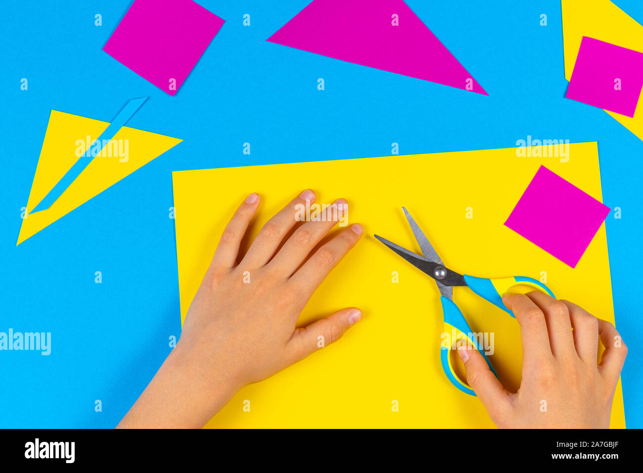 Childs hands cutting colored hi-res stock photography and images - Alamy