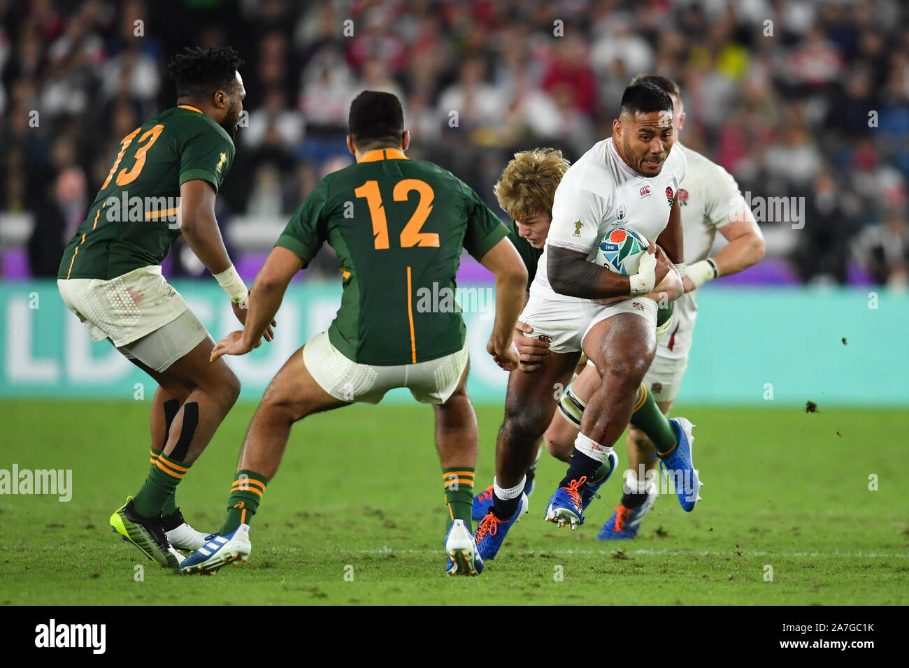 England's Manu Tuilagi is tackled by South Africa's Frans Steyn during ...