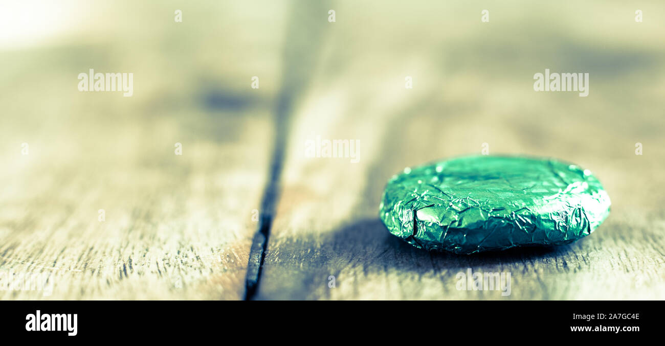 Foiled mint chocolates | Thin Mints | Mint Cream Packets Stock Photo ...