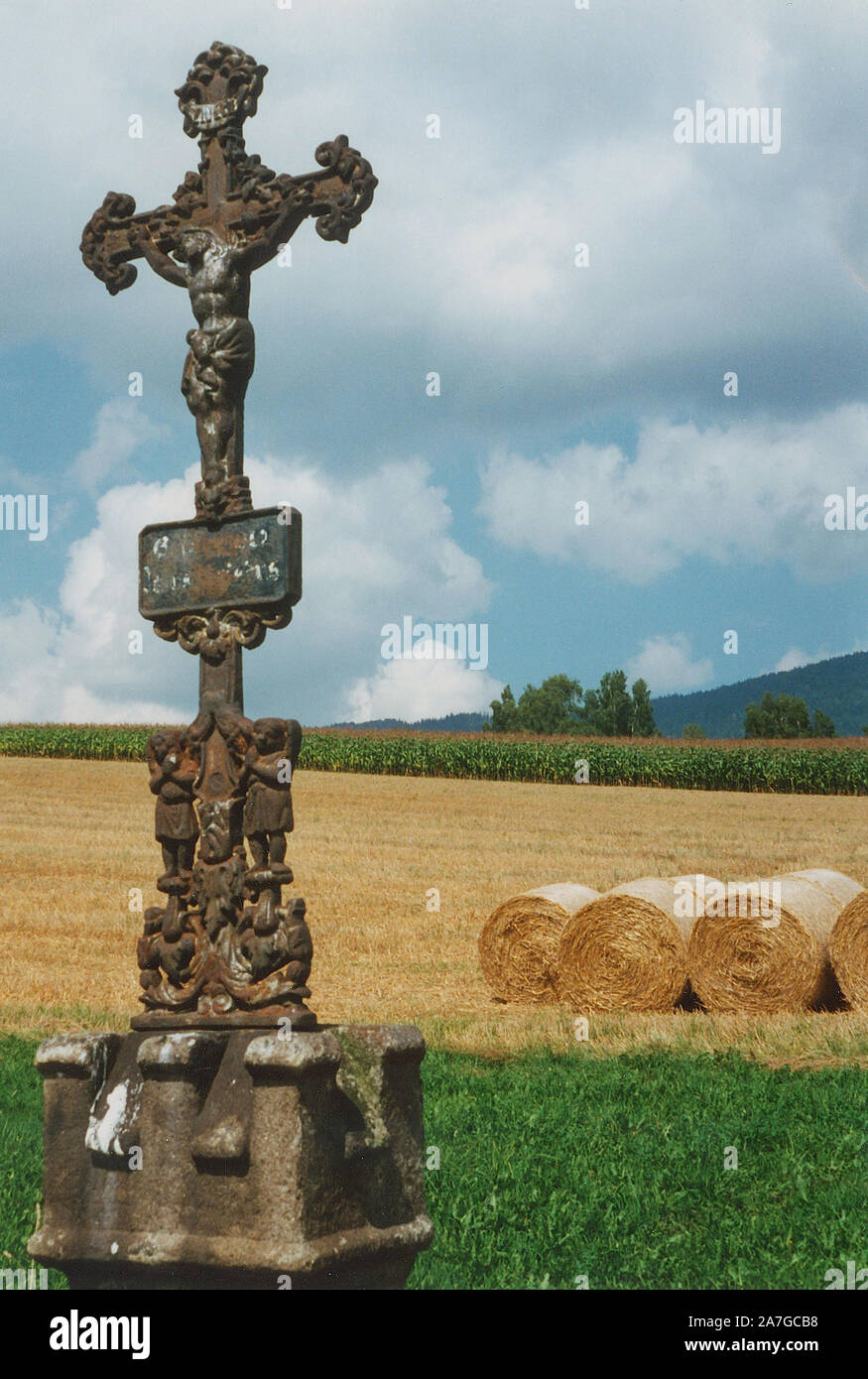 Traditional catholic metal cross at a field in rural Bavaria, Germany ...