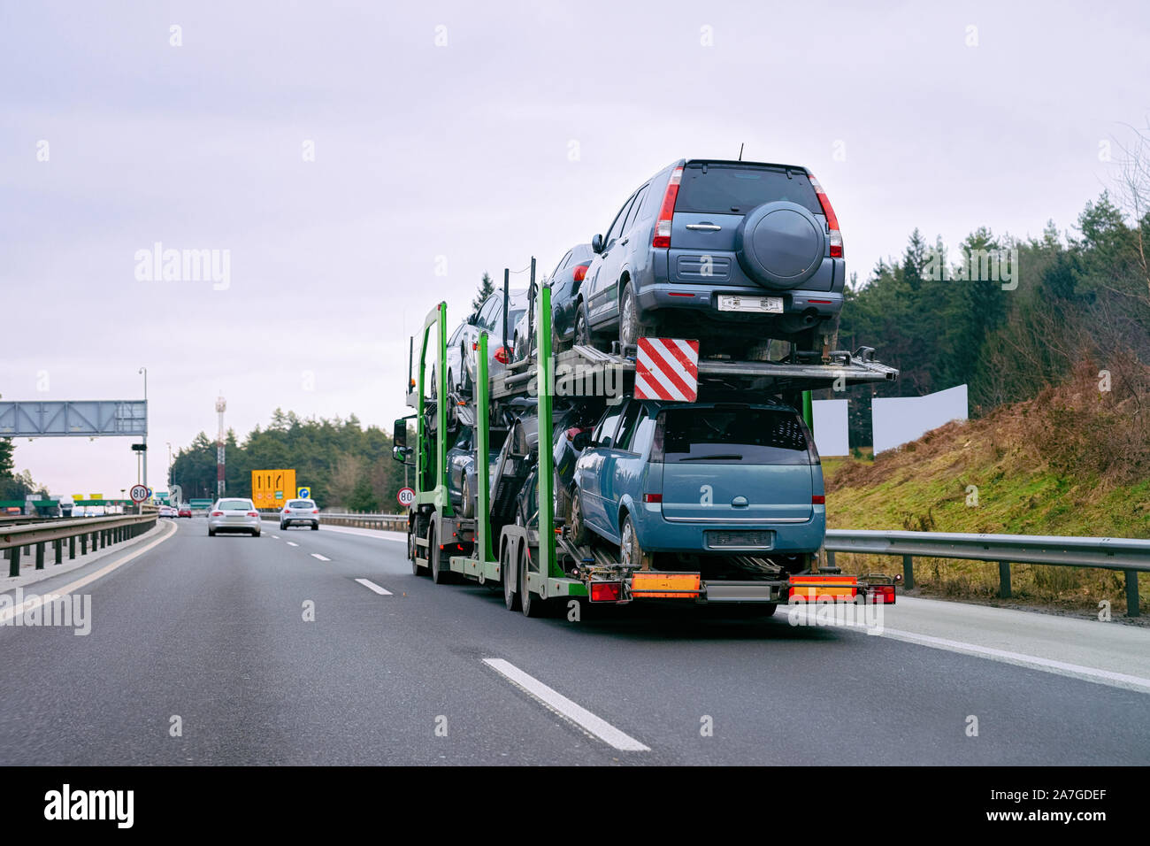 Cars carrier transporter truck in road Auto vehicles Stock Photo - Alamy