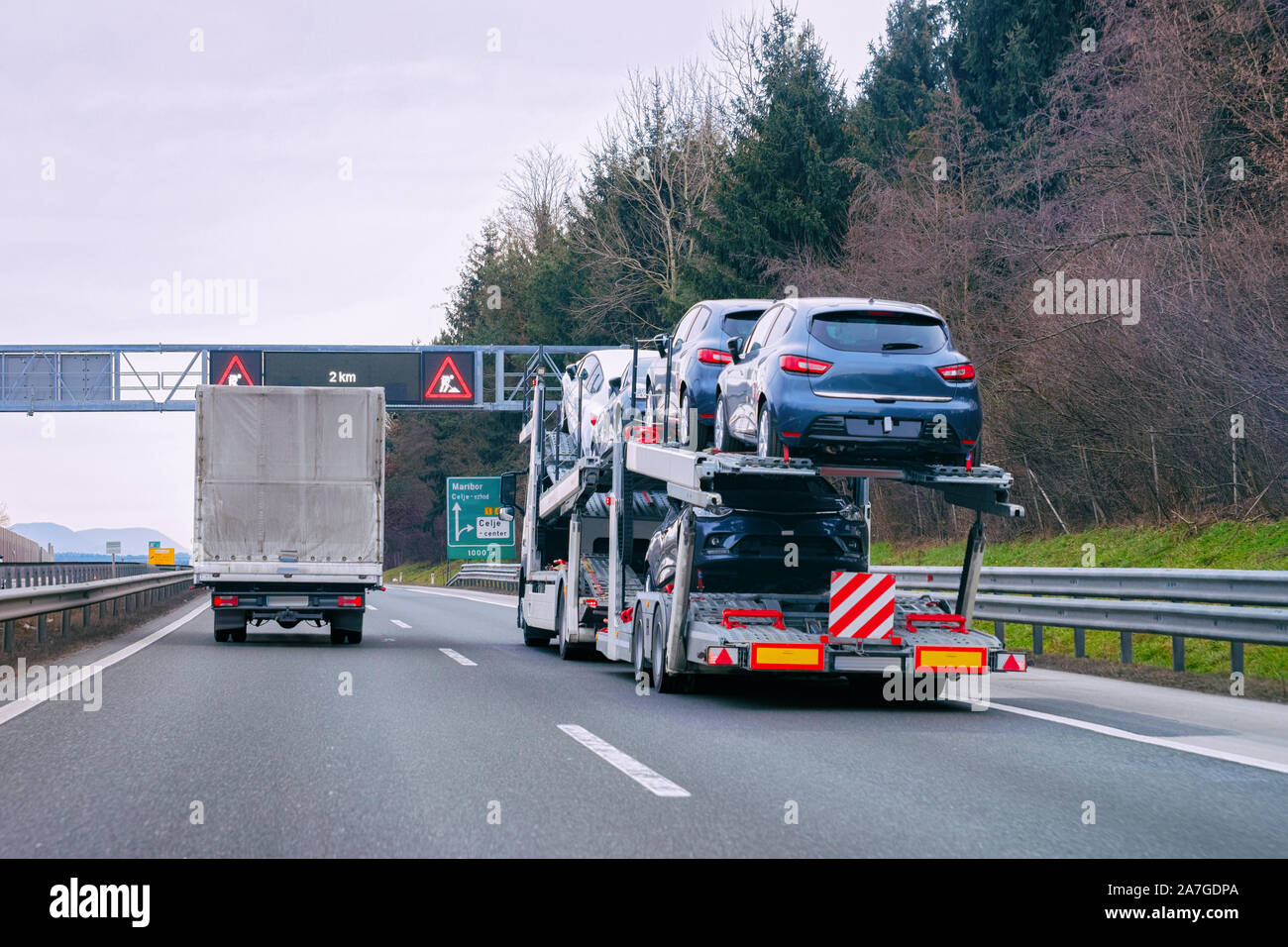 Car carrier transporter truck in road Auto vehicles Stock Photo - Alamy