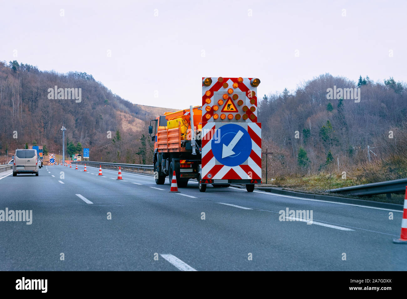 Truck carrying arrow down left reflective direction road sign Stock ...