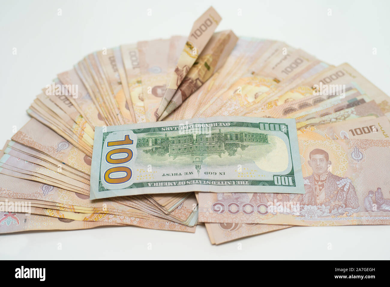 Thai money 1000 baht and 100 dollar, thai bank note background, next to ...