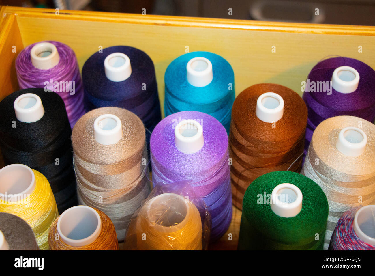 Colorful Spools of Quilting Thread in a drawer Stock Photo - Alamy