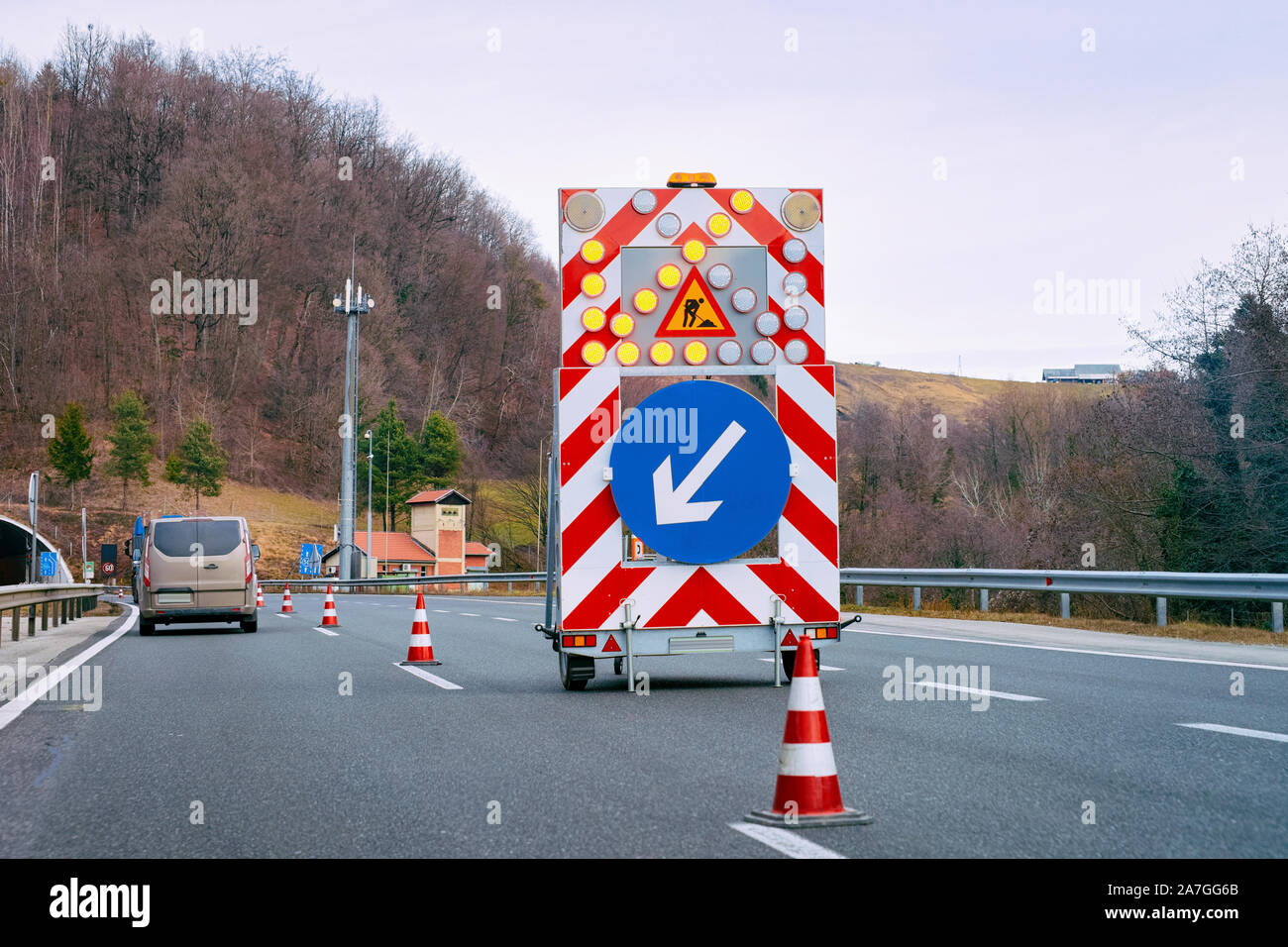 Arrow down left reflective direction road sign indicator Stock Photo ...
