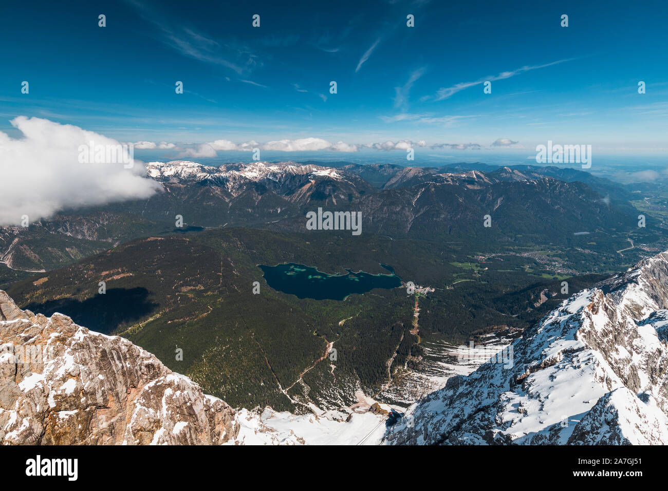 At the top of Zugspitze, highest mountain of Germany, during summer ...