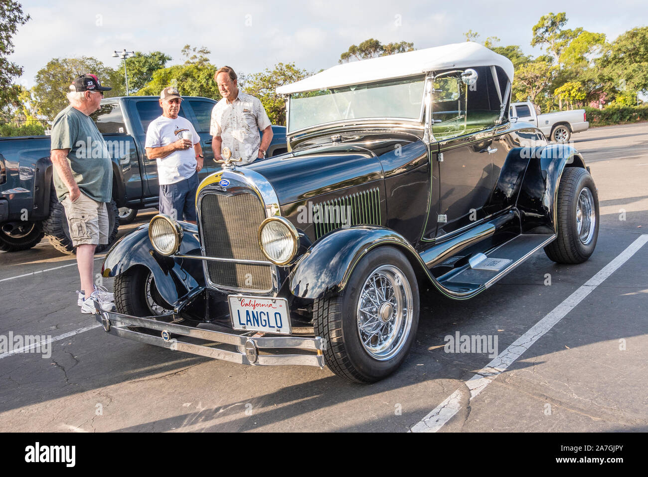 1930s black Ford convertible with a white canvas top with car ...