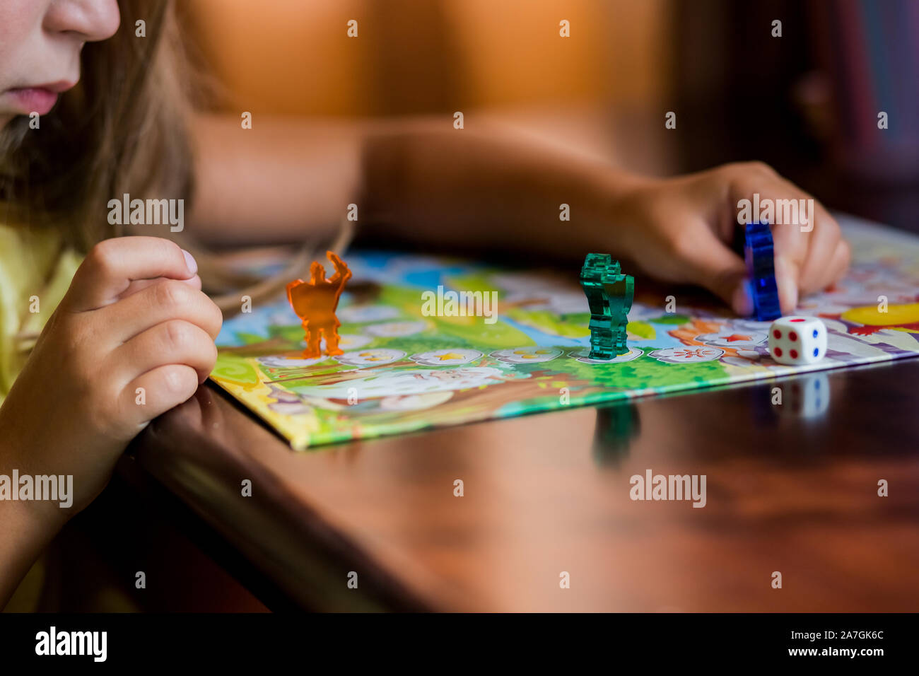 colorful play figures with dice on board.Board game and kids leisure ...