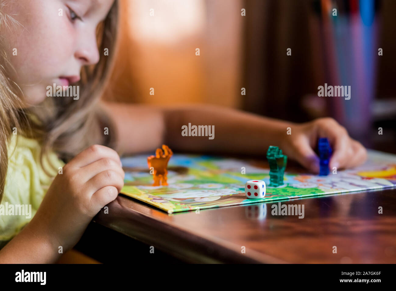 colorful play figures with dice on board.Board game and kids leisure ...