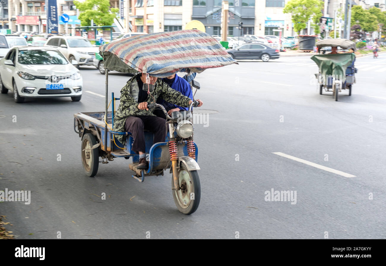 Cyclists and moped riders hi-res stock photography and images - Alamy