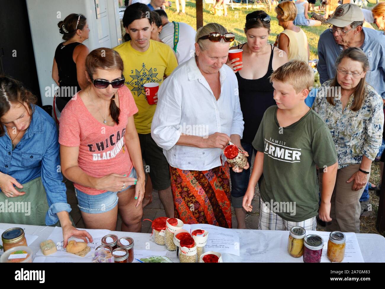 Various kinds of food, including canned items, freely exchanged at a ...