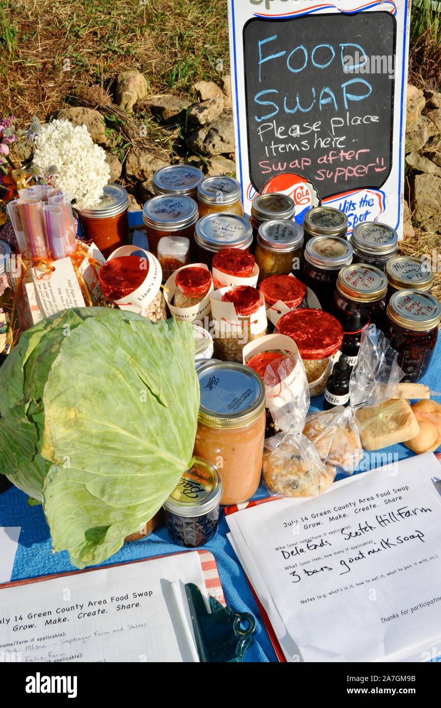 Various kinds of food, including canned items, freely exchanged at a ...