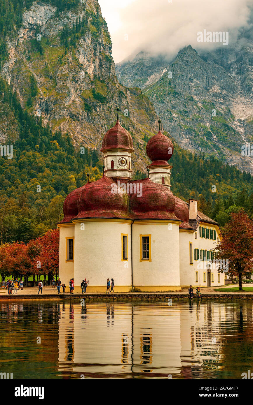 Konigsee lake with st Bartholomew church surrounded by mountains ...
