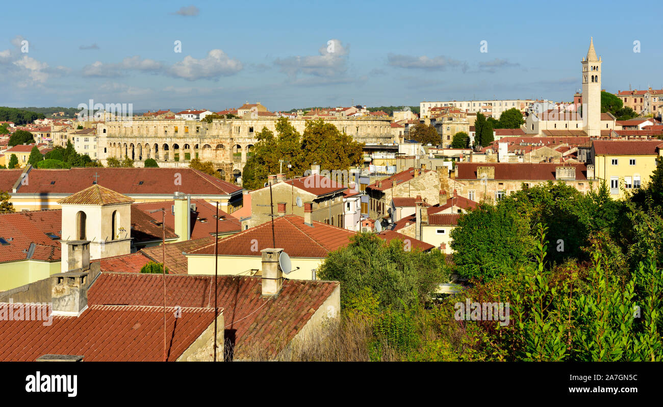 View over rooftops of Pula, Croatia with Roman amphitheatre arena and ...