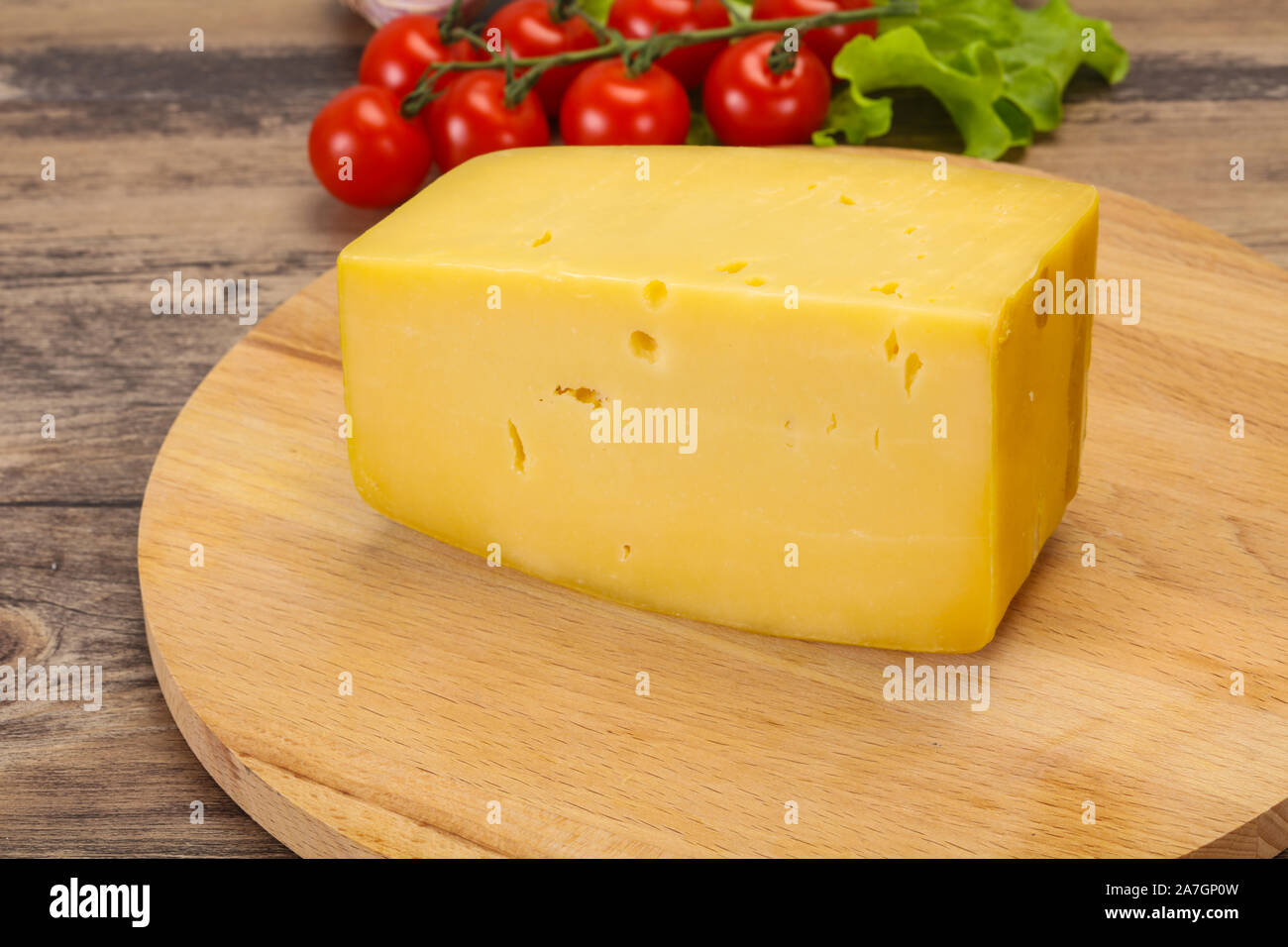 Swiss Hard yellow tasty cheese brick Stock Photo - Alamy