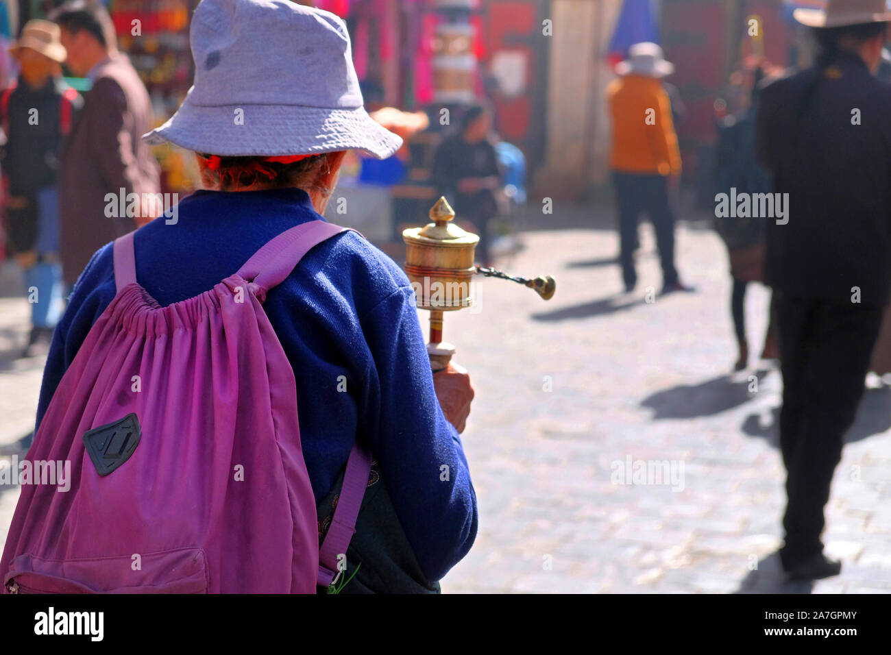People dressed in traditional clothes walking and praying on the old ...
