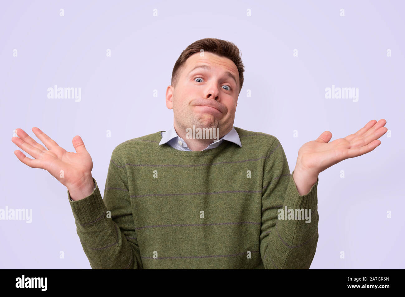 Ignorance and arrogance concept. Young man shrugging shoulders who ...