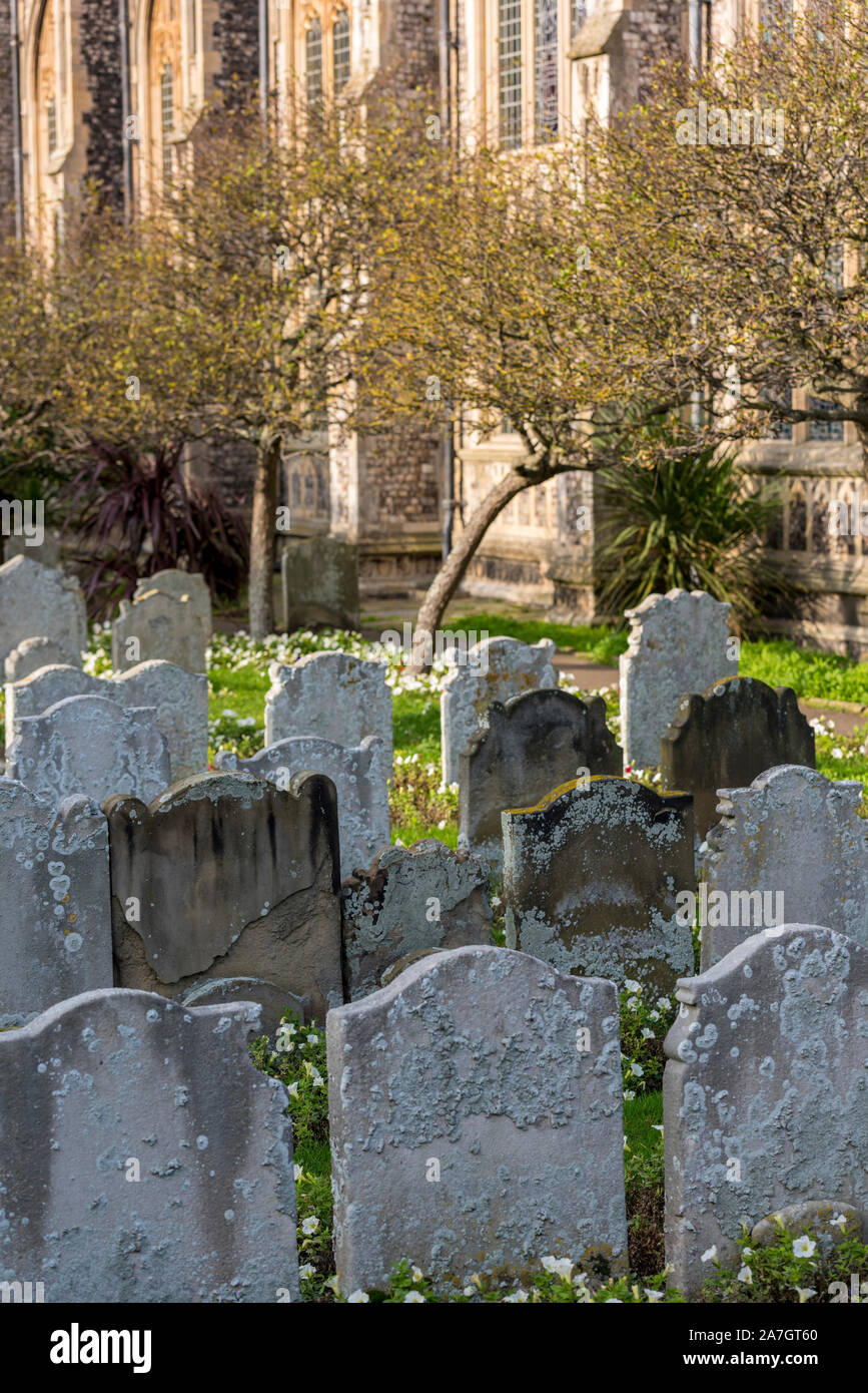 ancient and antique gravestones and headstones in a graveyard by the ...