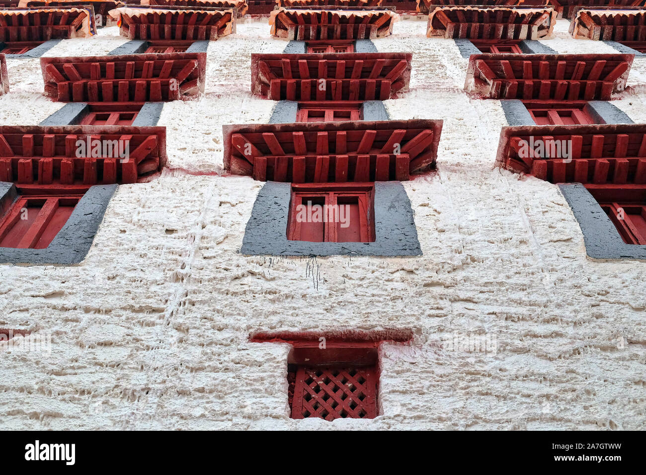 Front view of Potala Palace in Lhasa, Tibet, showing red windows on a ...