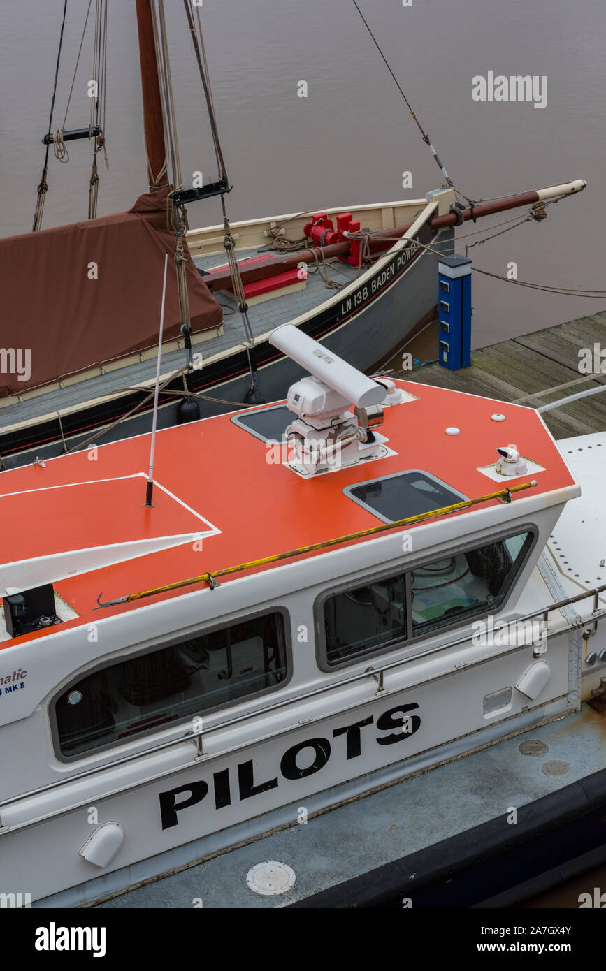 a modern pilot boat alongside a traditional thames or norfolk wooden ...