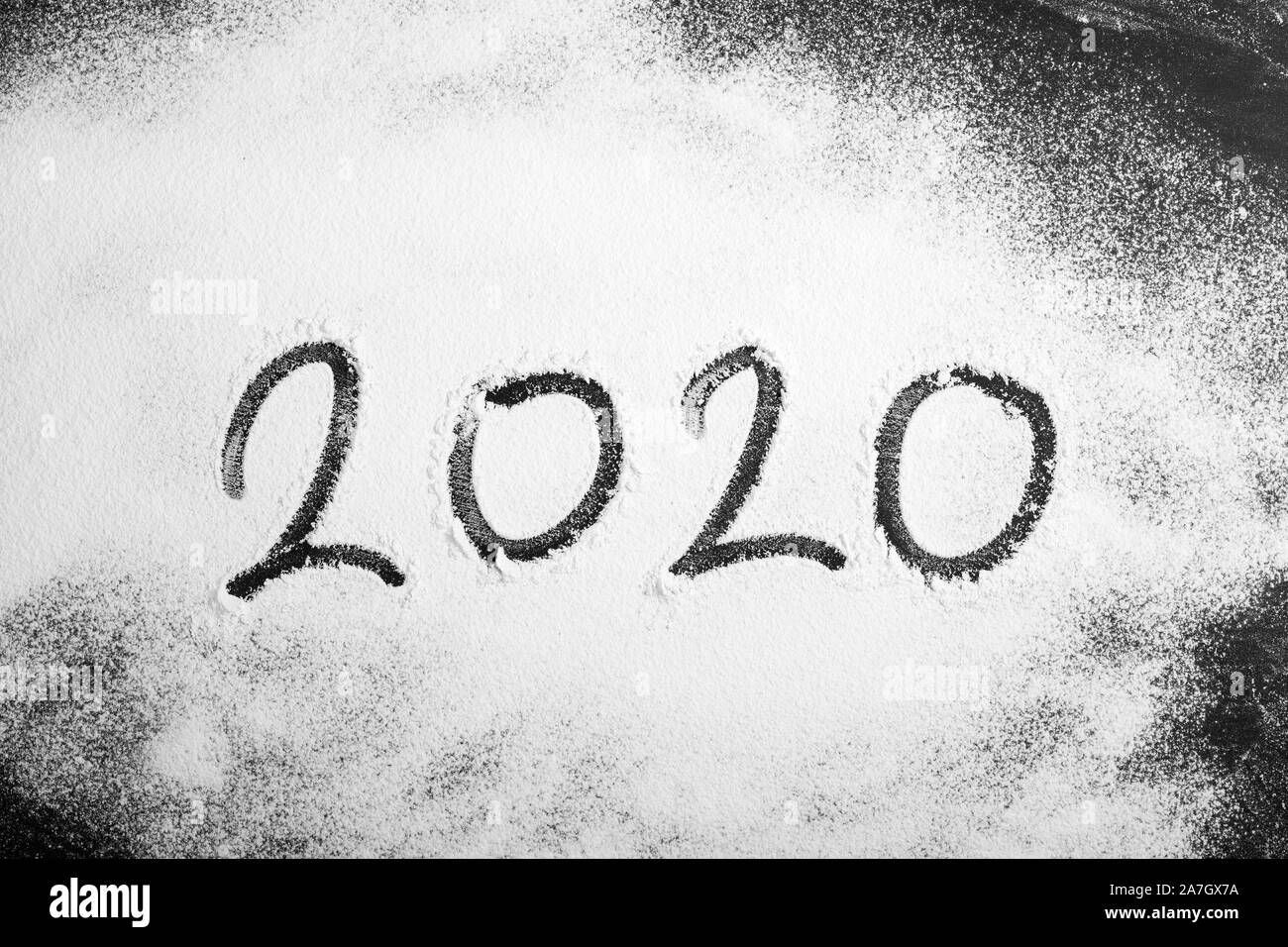 2020 figures with handwriting on white powder Stock Photo - Alamy