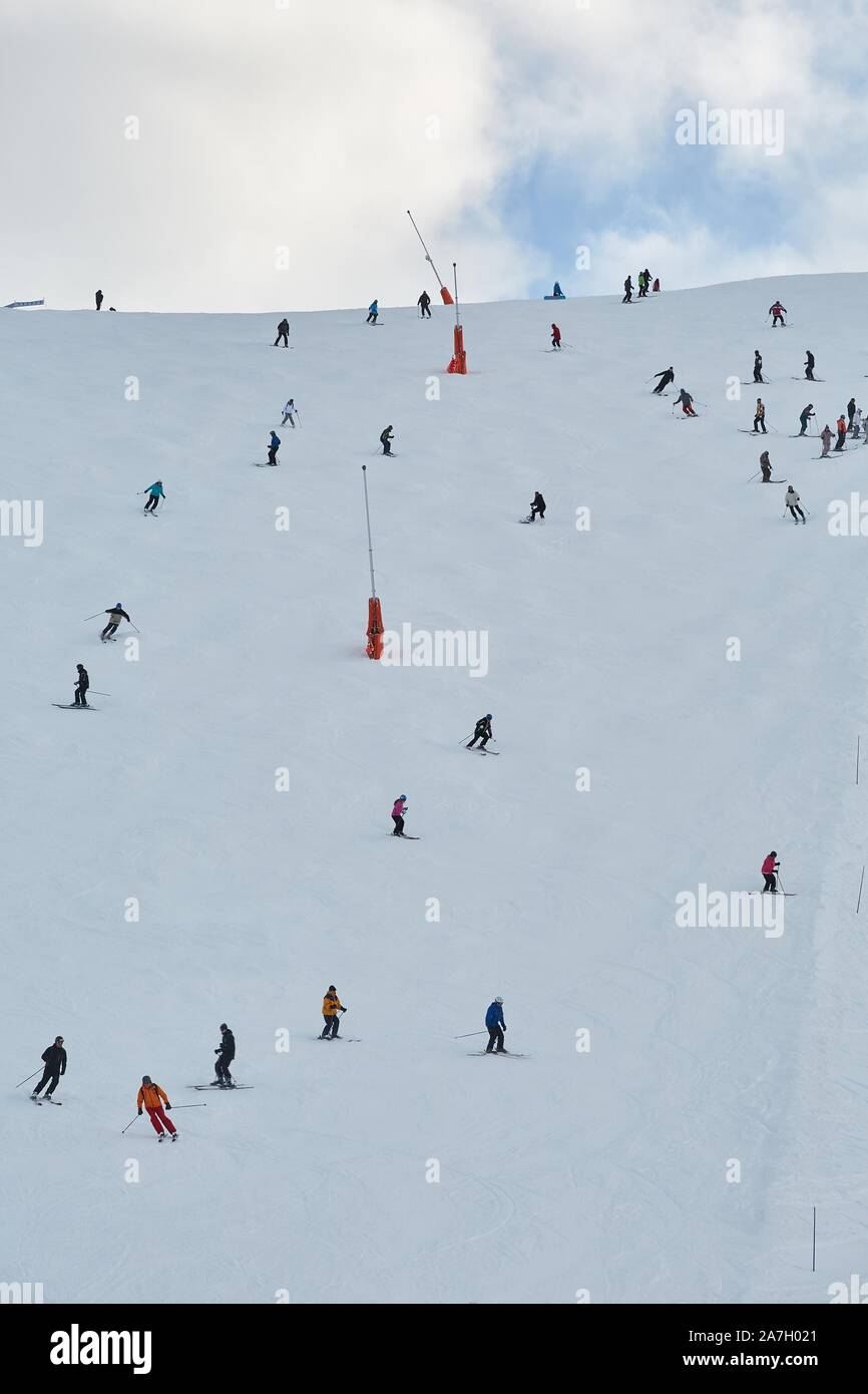 Skiing slopes with skiers Stock Photo - Alamy