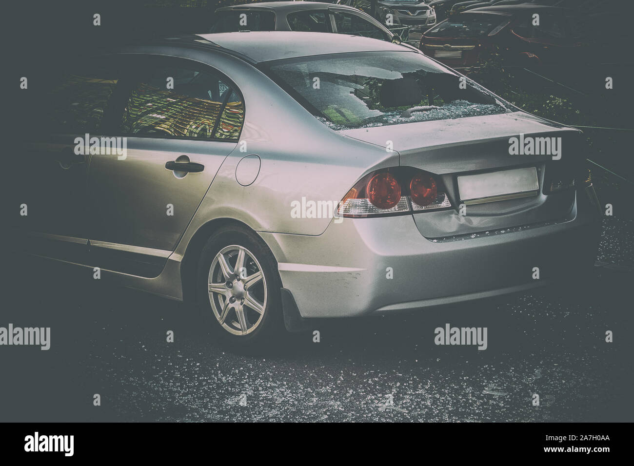 Broken rear glass of car, spread fragments of glass on asphalt Stock ...